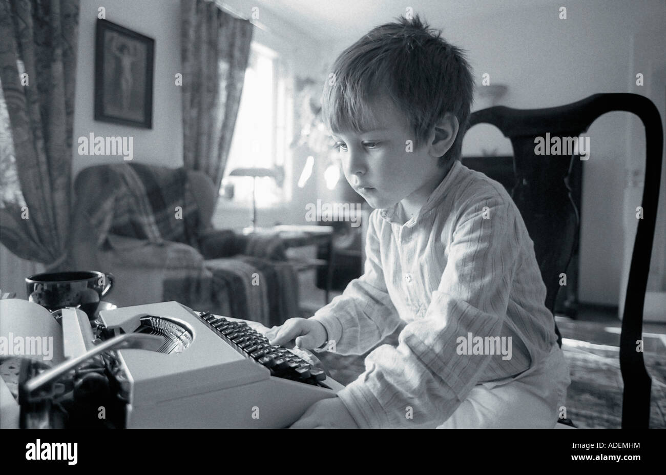 BOY WRITING ON A TYPEWRITER Stock Photo - Alamy