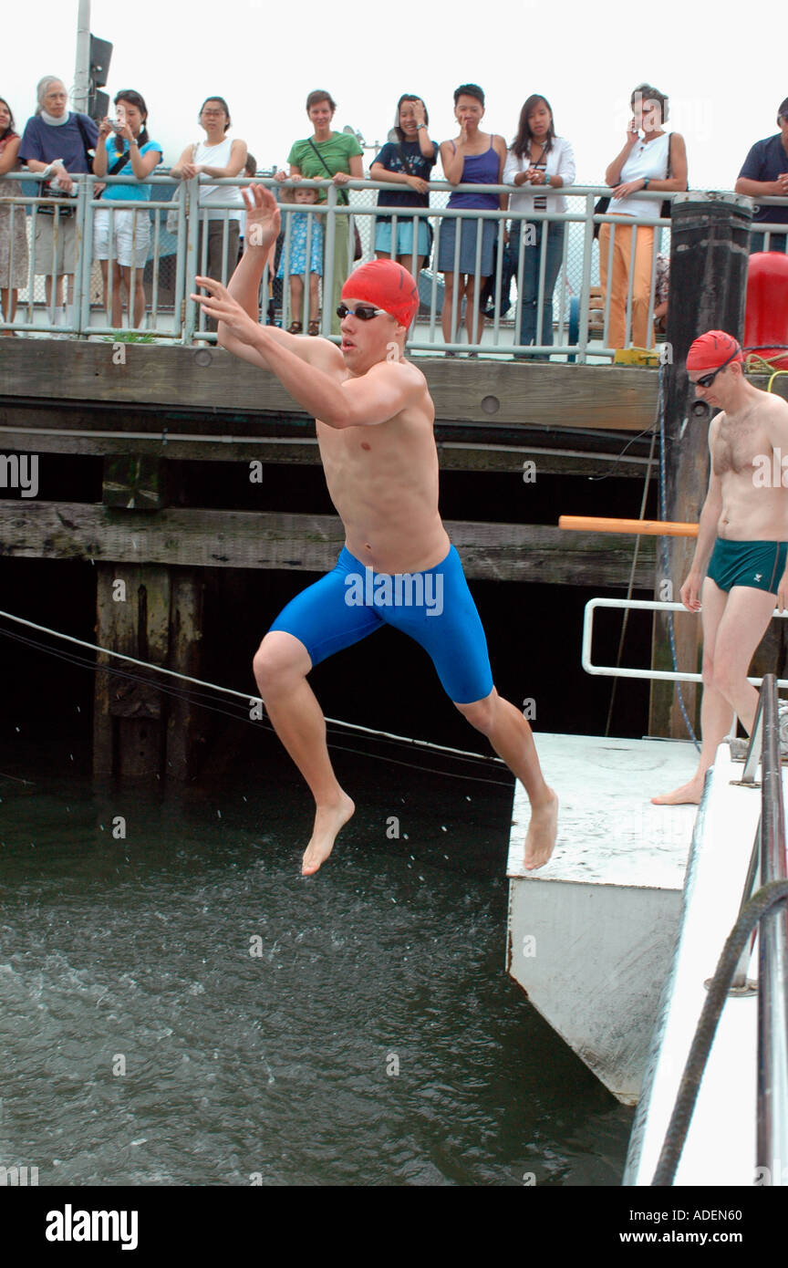 At the Race for the River swimming race competitors jump into the ...
