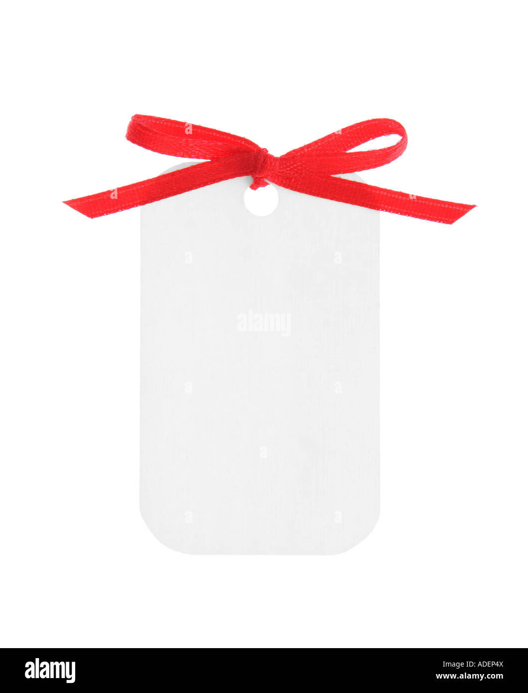 A white blank gift tag tied with red ribbon on white background ...