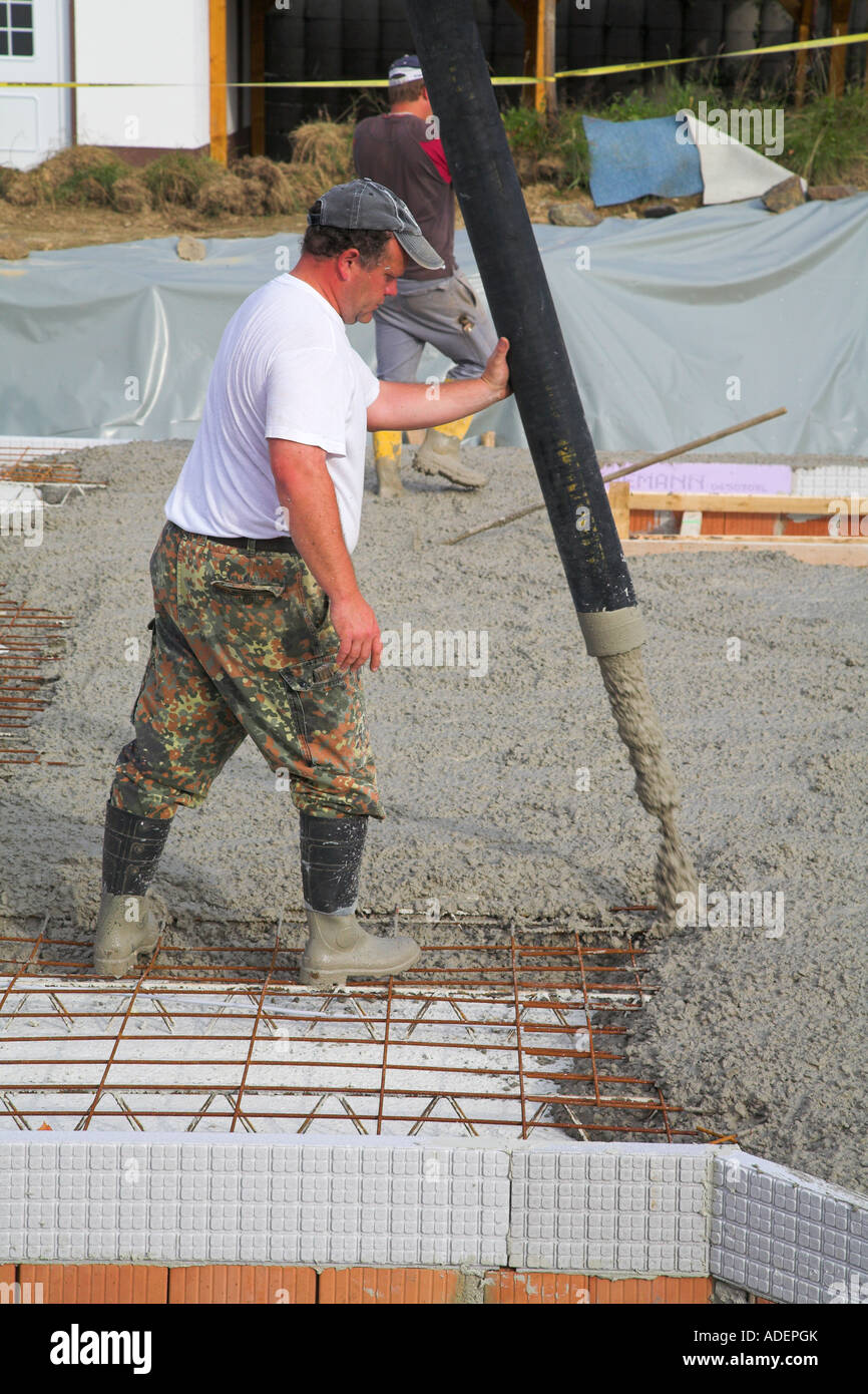 Pouring concrete floor working man hi-res stock photography and images ...