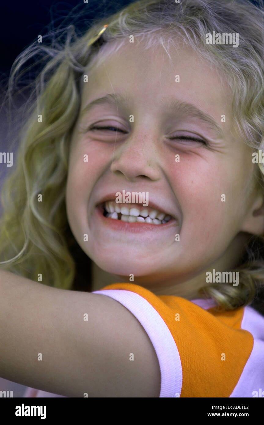 young girl with silly smile Stock Photo - Alamy