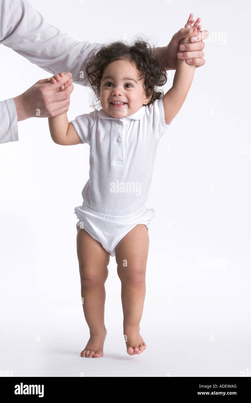 Baby girl first steps Stock Photo - Alamy