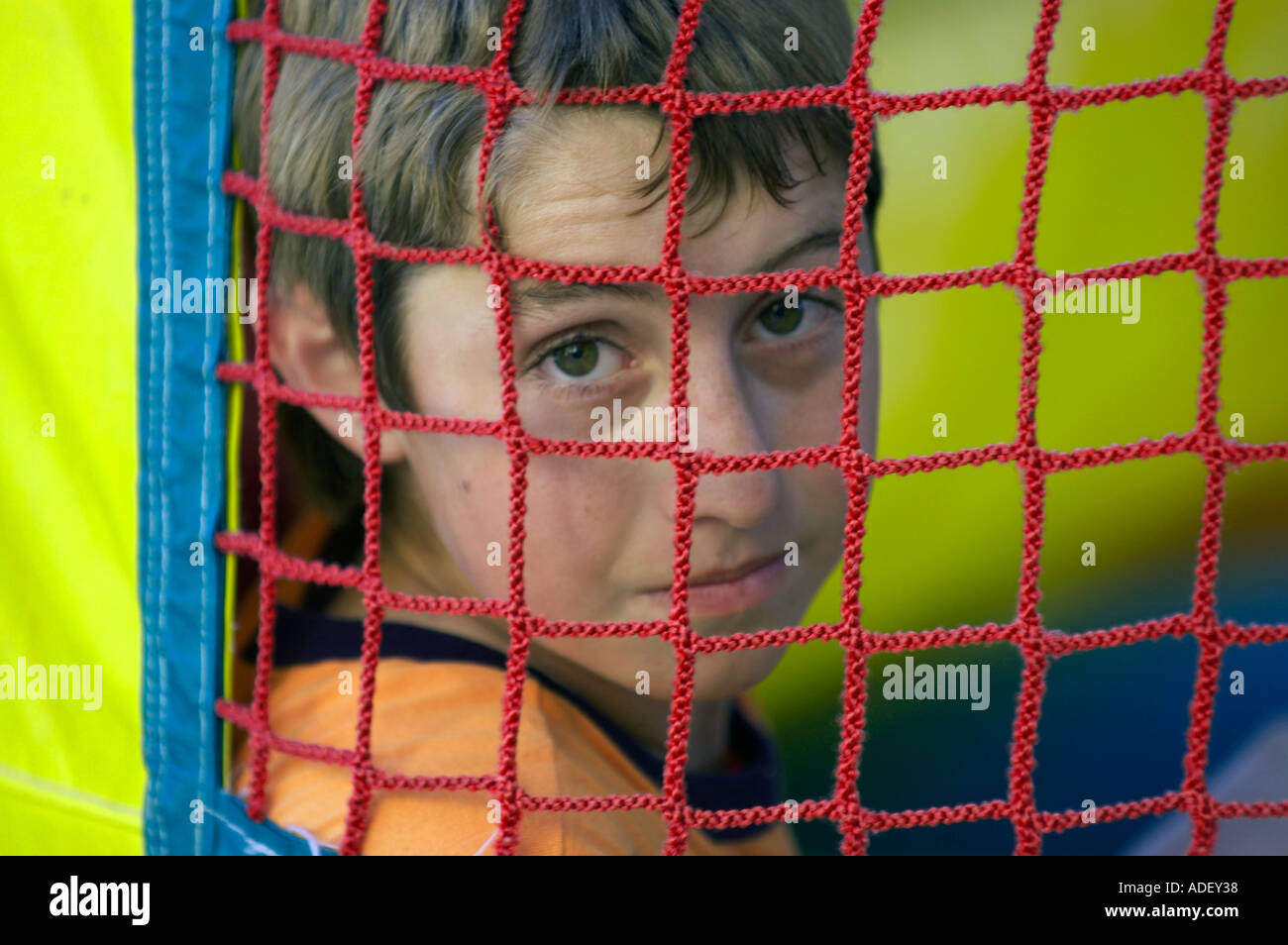 boy looking through net Stock Photo - Alamy