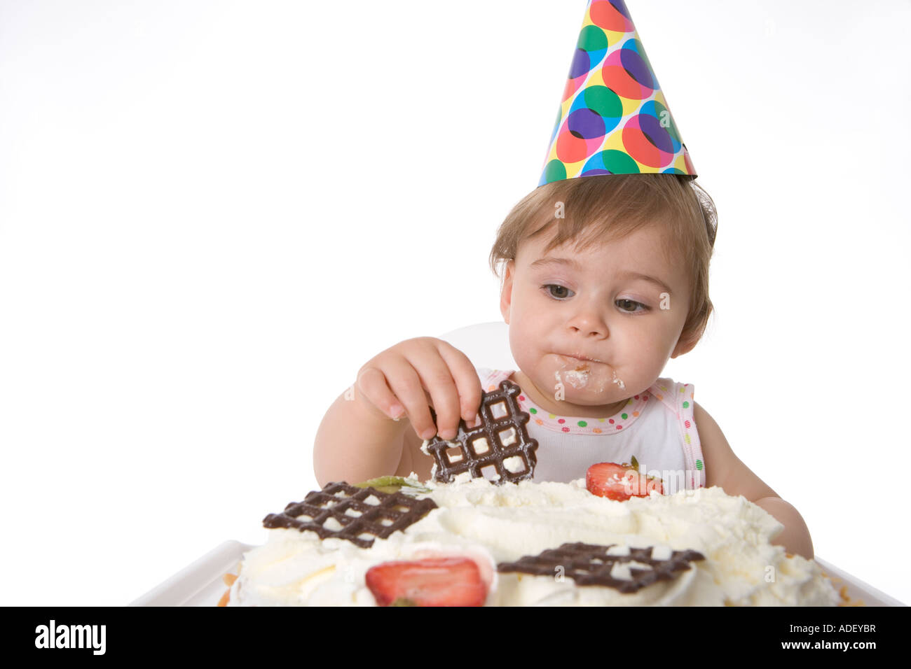 One year old baby girl eating from her birthday cake Stock Photo - Alamy