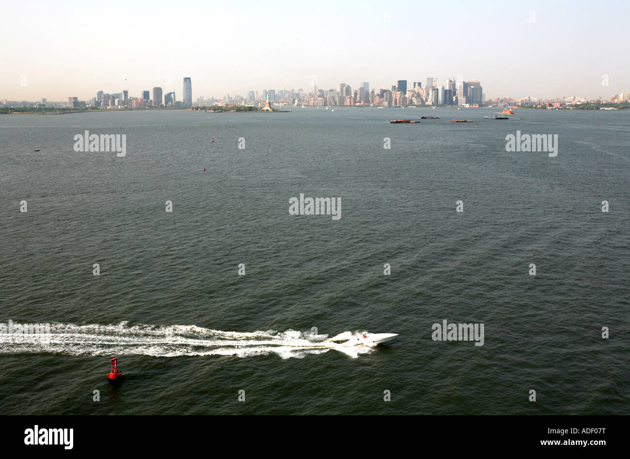 New York Manhattan skyline with a speed boat in foreground Stock Photo ...