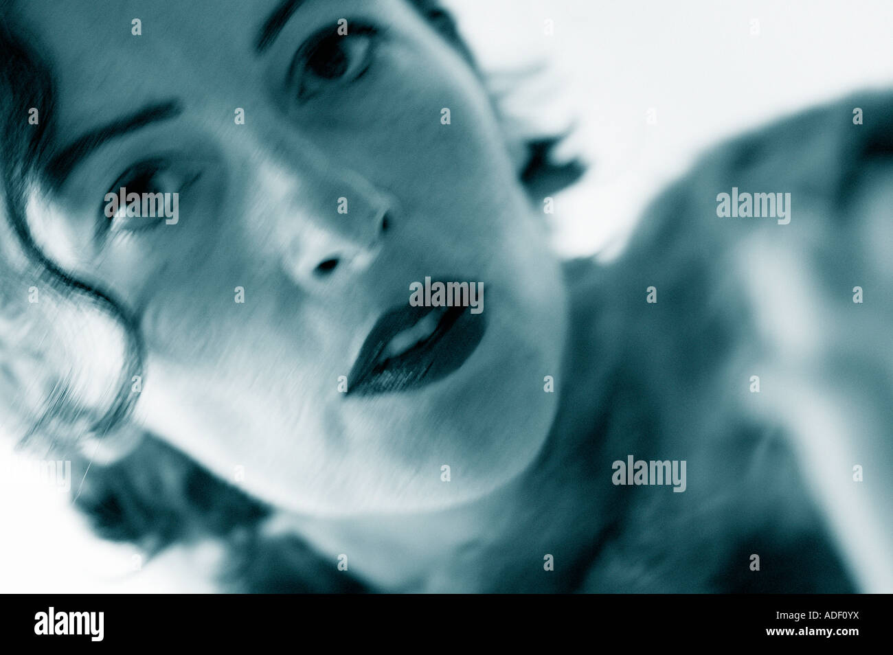 portrait of elegant woman looking into camera Stock Photo - Alamy