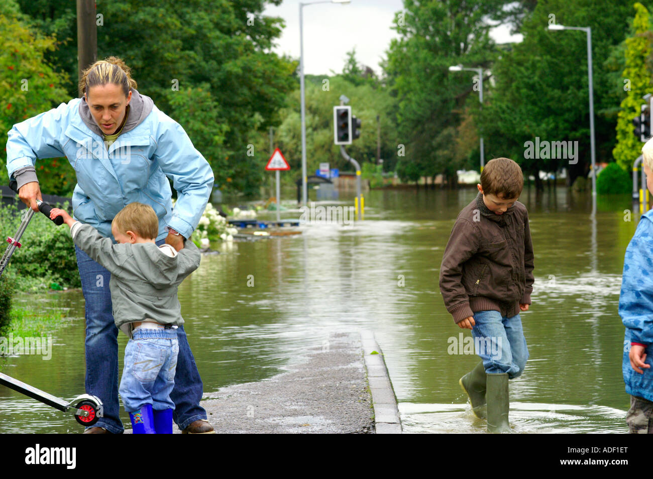 mother rescuing her children before flood wave. Evesham, Worcestershire ...