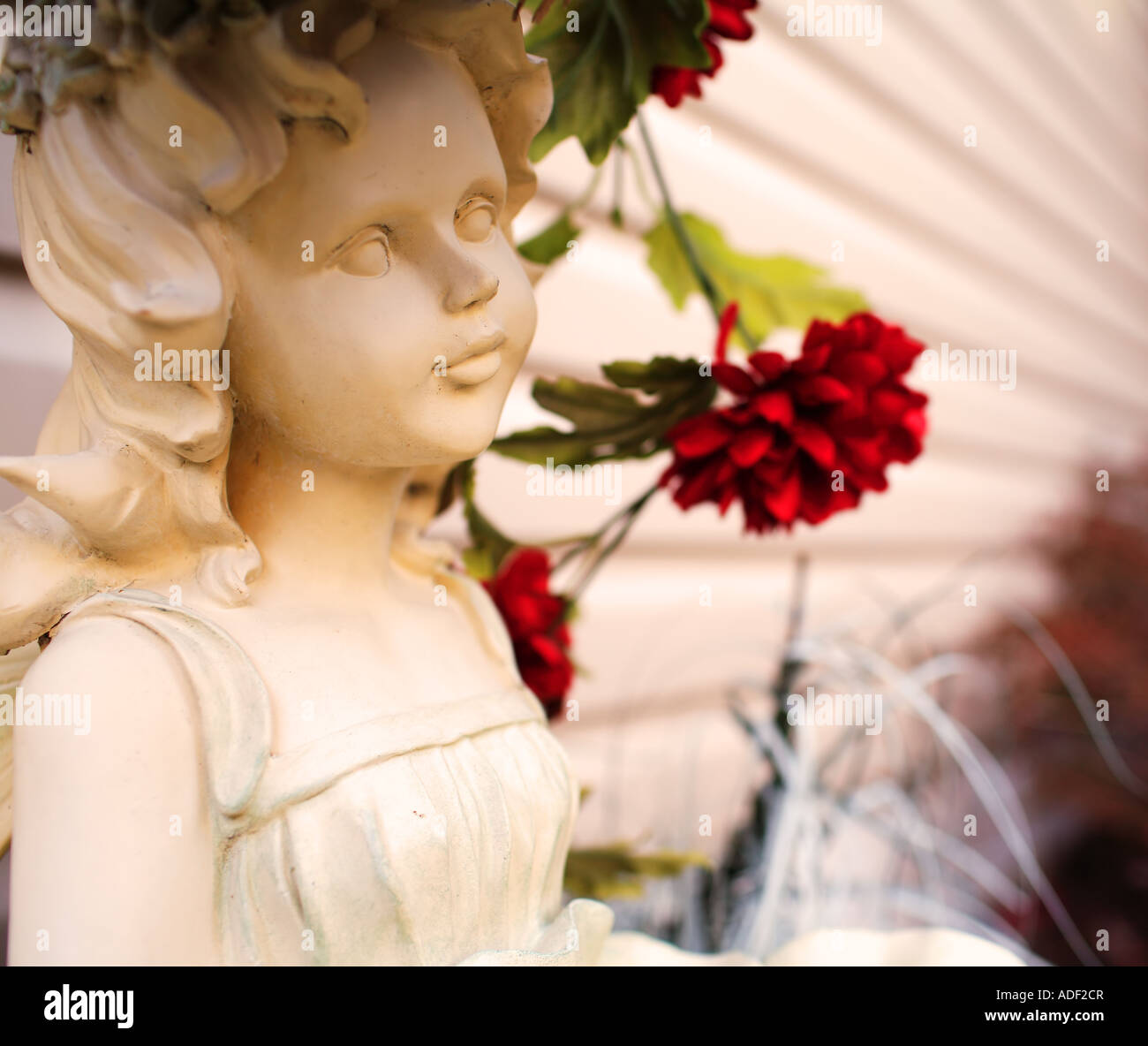 Statue Girl sits and thinks in a garden Stock Photo - Alamy