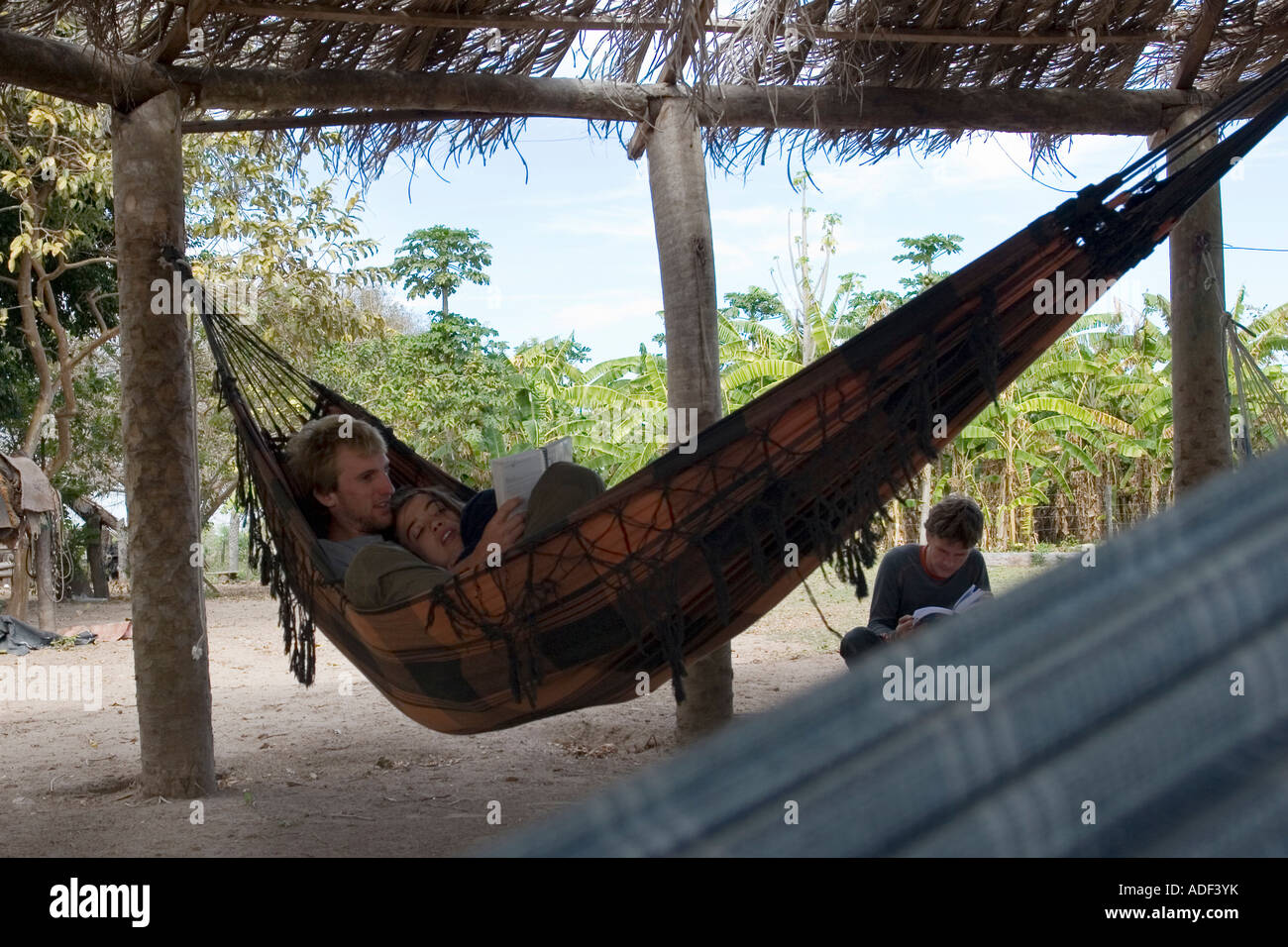 Couple Lying in a Hammock Stock Photo - Alamy
