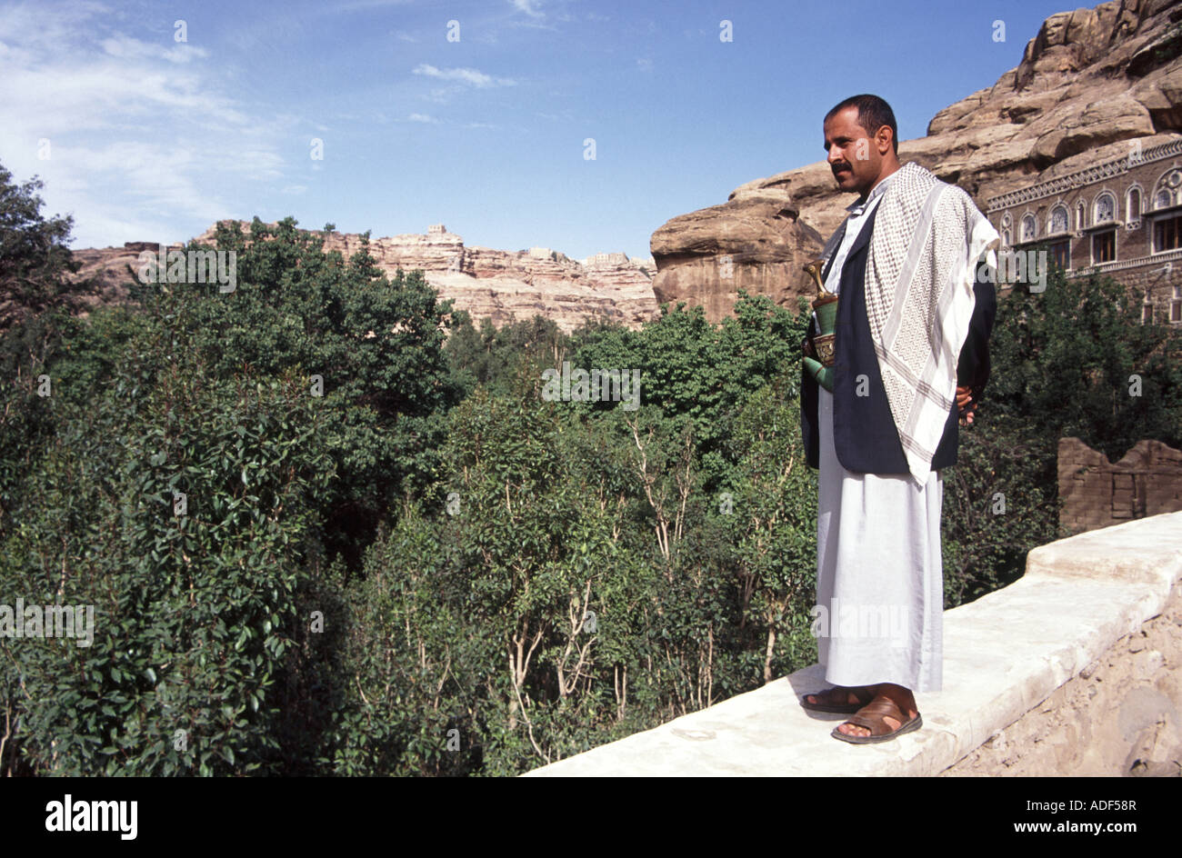 Local guide on roof of Dar Al Hajar Palace, overlooking qat tree ...