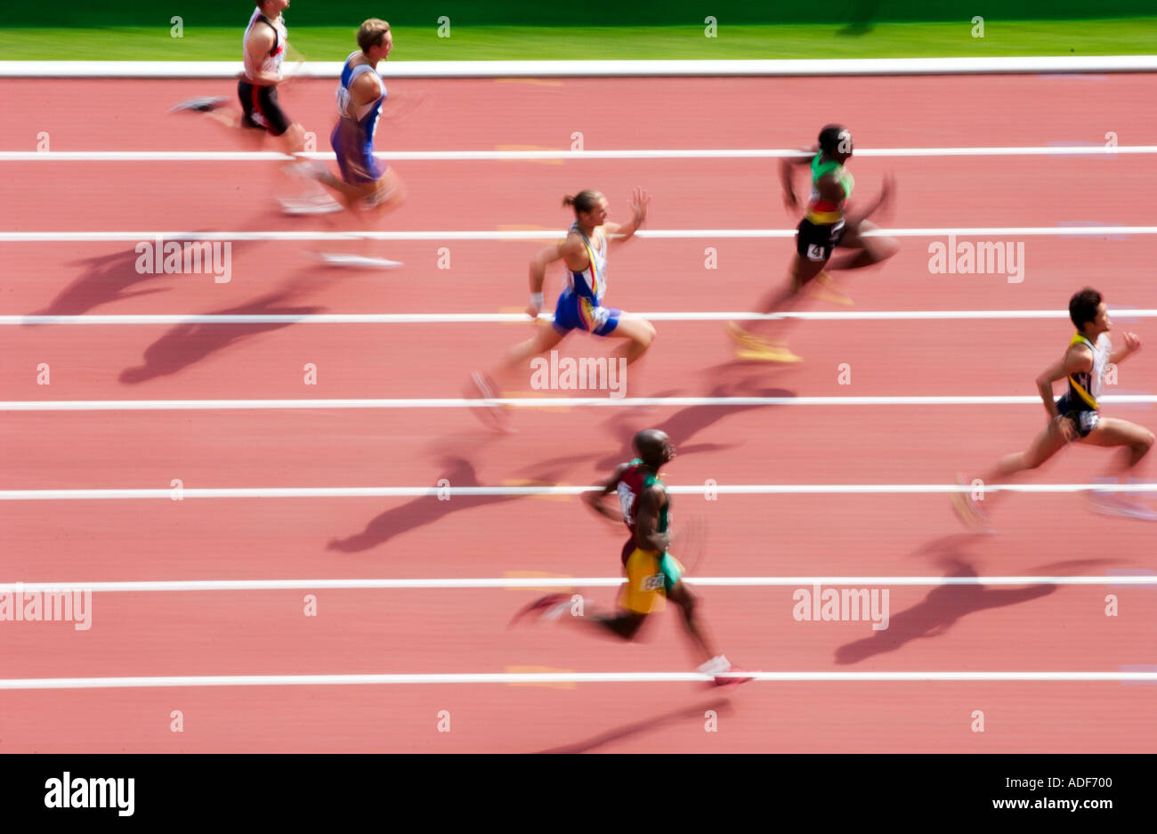 sprinters speeding down the track towards the finish line Stock Photo ...