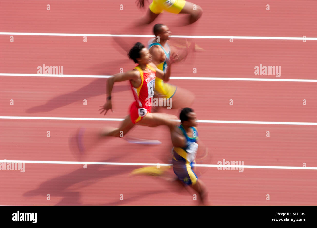 sprinters speeding down the track towards the finish line Stock Photo ...