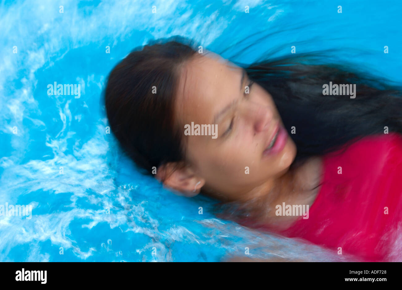 Teenager floats in pool hi-res stock photography and images - Alamy
