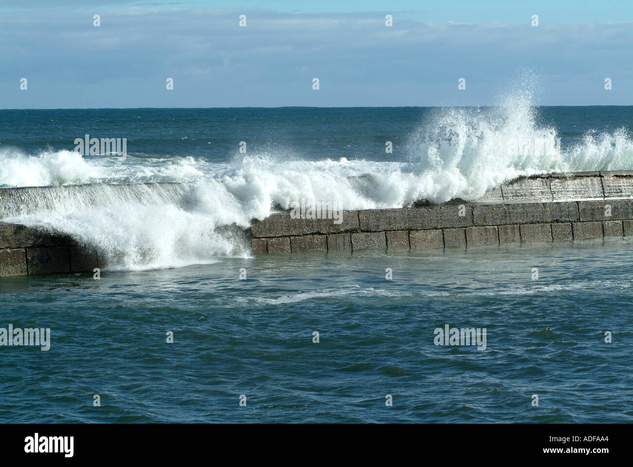 Wave over harbour wall hi-res stock photography and images - Alamy
