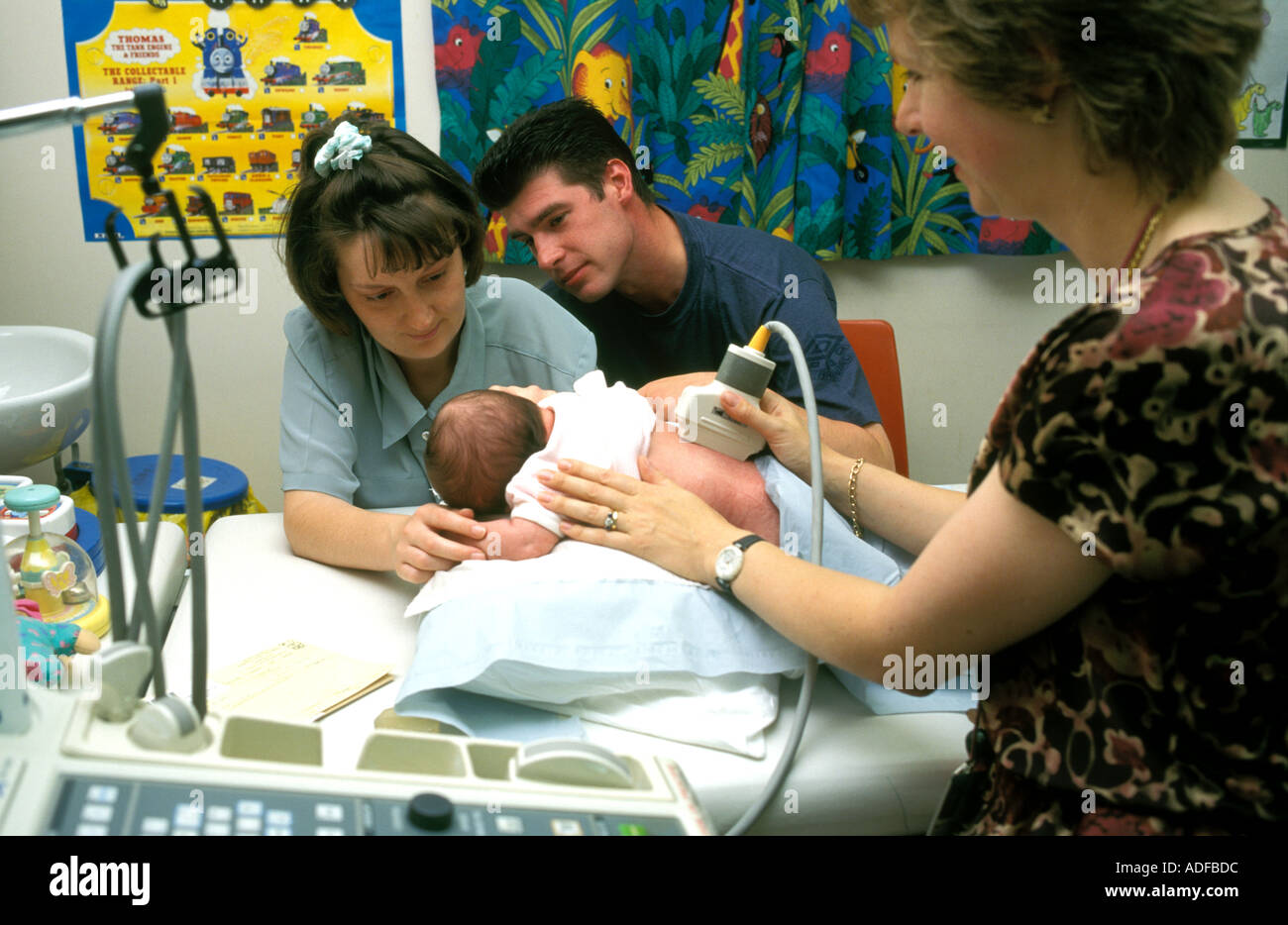 Small newly born baby having a diagnostic ultra sound scan in hospital ...