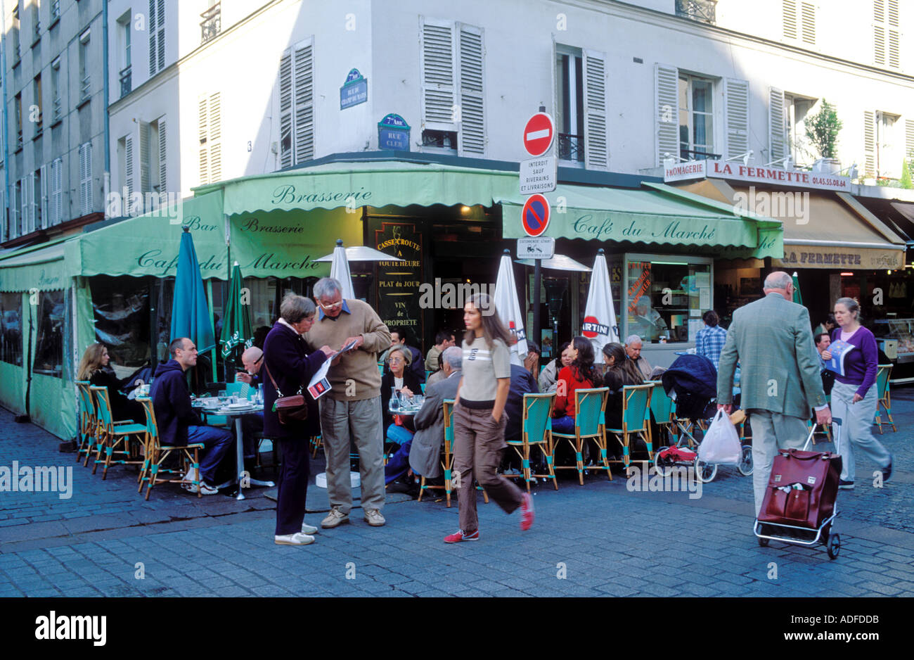 France Paris Older couple reading a tourist map on Rue Cler Stock Photo ...