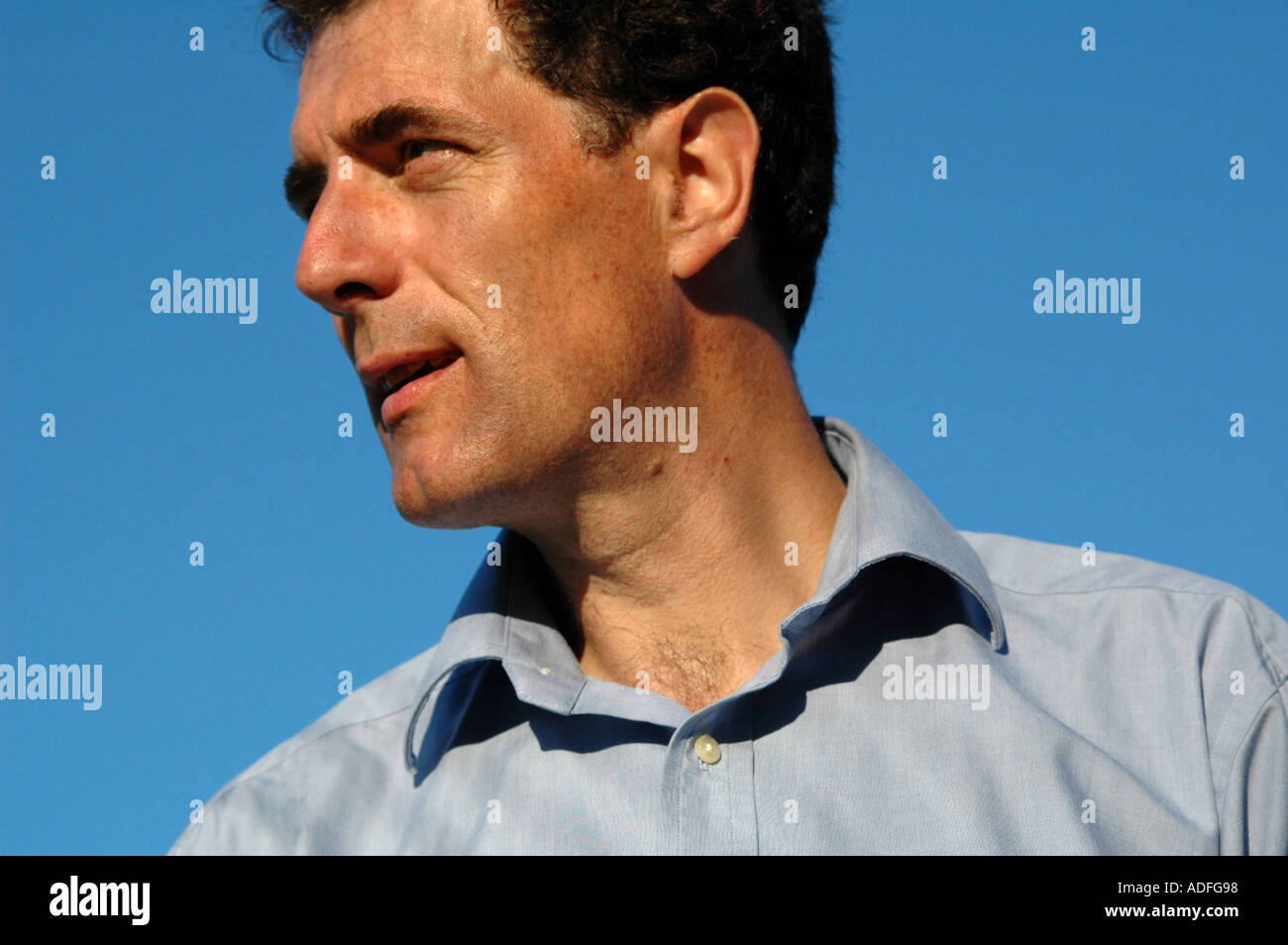 Handsome man looking into the distance, contemplating the future Stock ...