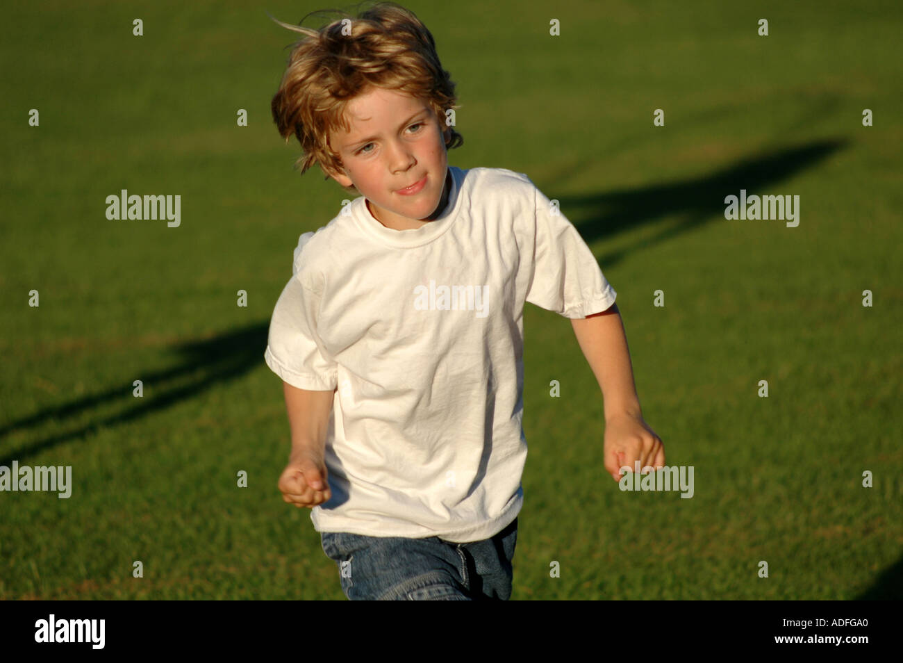 child running outside at the park Stock Photo - Alamy