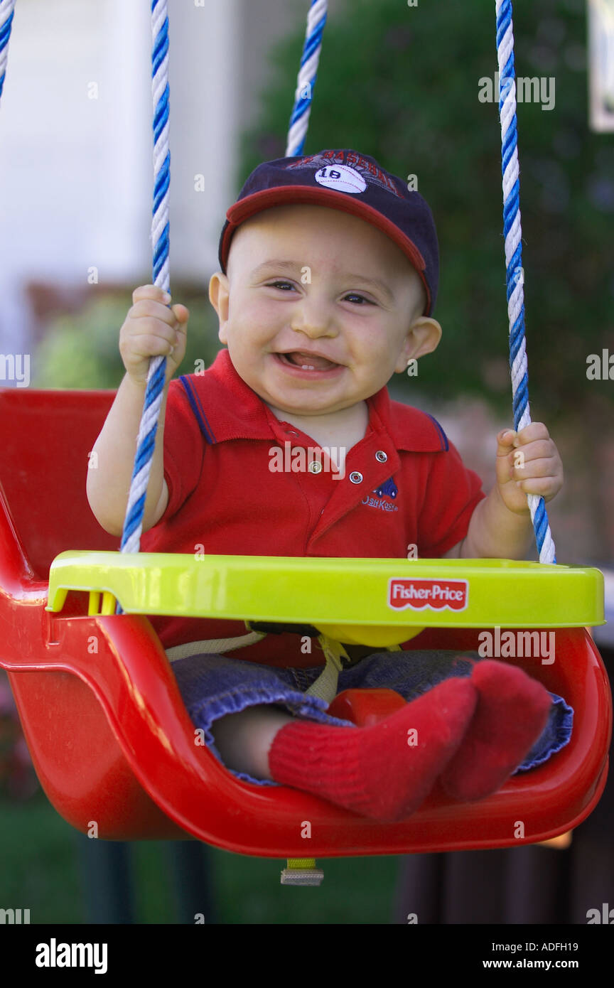 happy baby on swing Stock Photo - Alamy