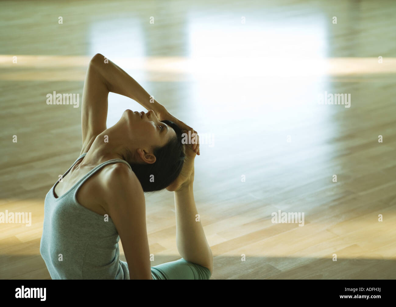 Woman floor stretches touching toes hi-res stock photography and images ...