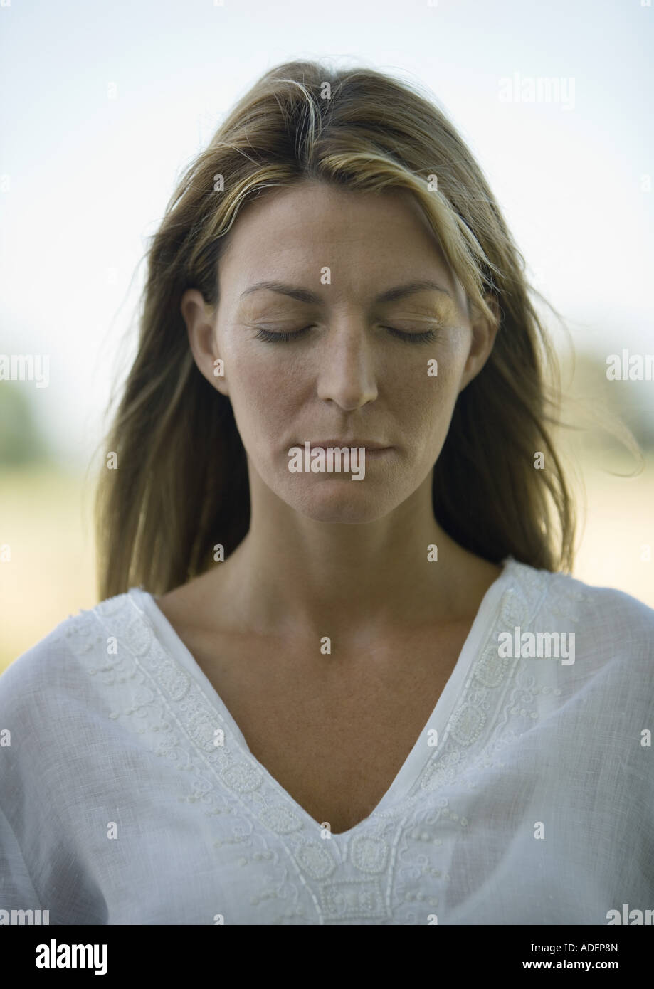 Woman with eyes shut, portrait Stock Photo - Alamy