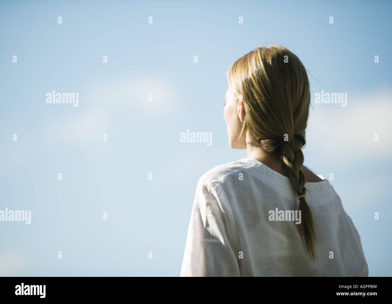 Woman facing sky, rear view Stock Photo - Alamy