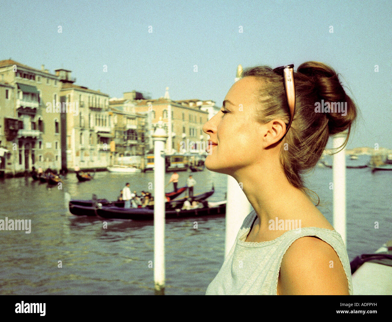 YOUNG WOMAN INTO ECSTASIES IN VENICE ITALY Stock Photo - Alamy