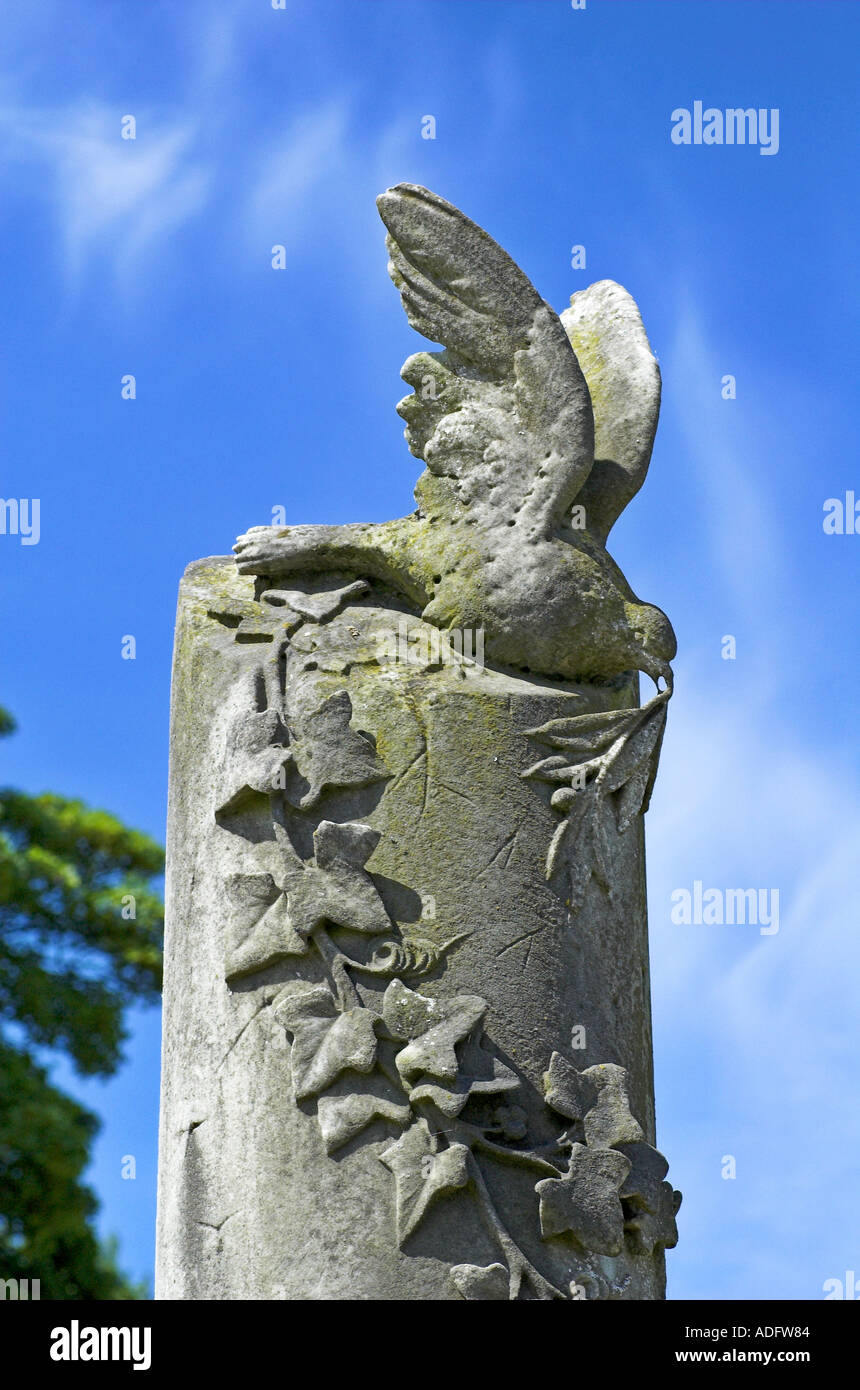Masonry monument depicting a dove a bird of peace with an olive branch ...