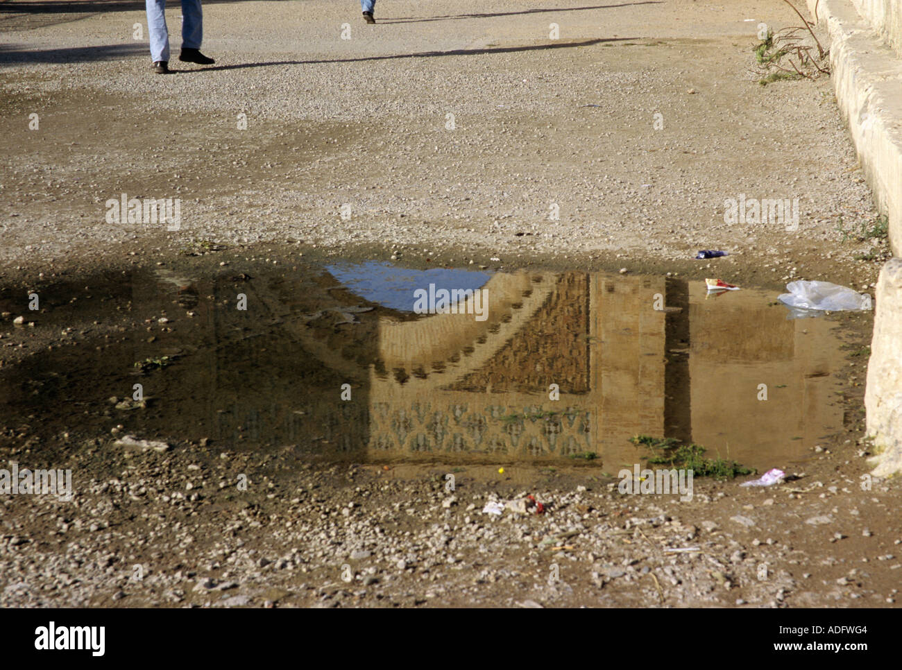The city gate reflected in the puddle, Marrakech, Morocco Stock Photo ...