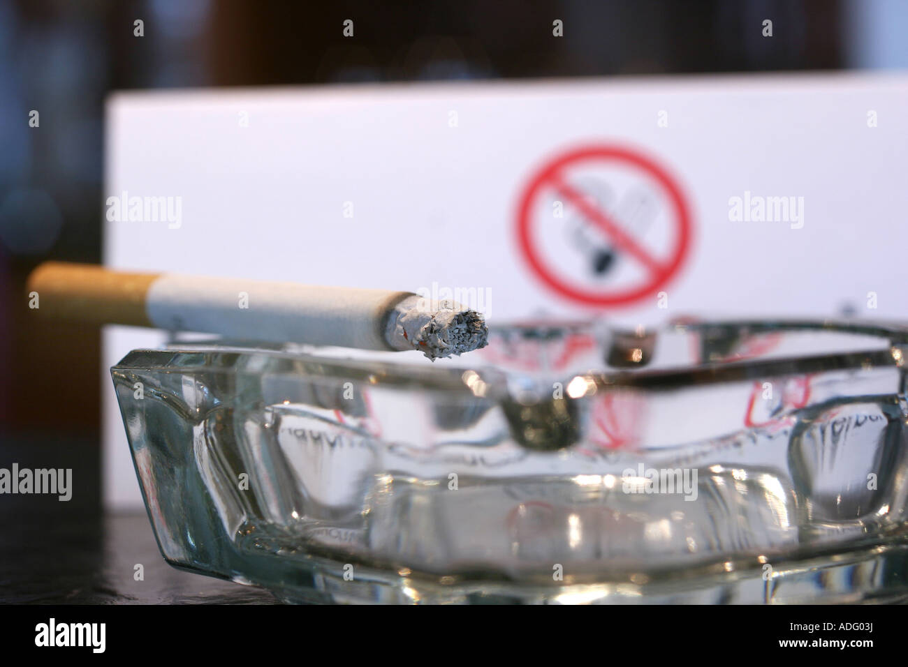ashtray and a no smoking sign Stock Photo - Alamy