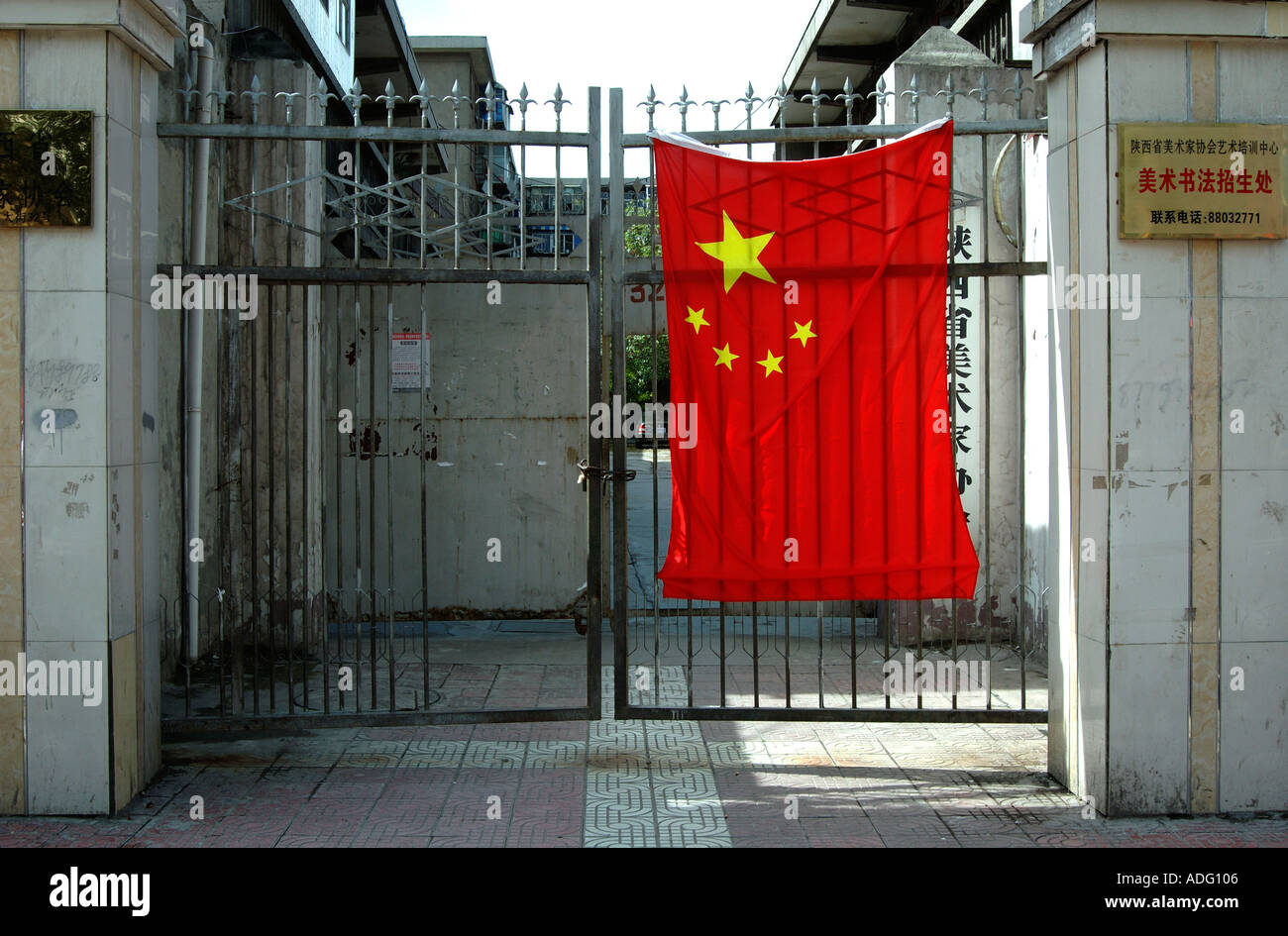 Chinese flag hanging outside military building in Xian China Stock ...