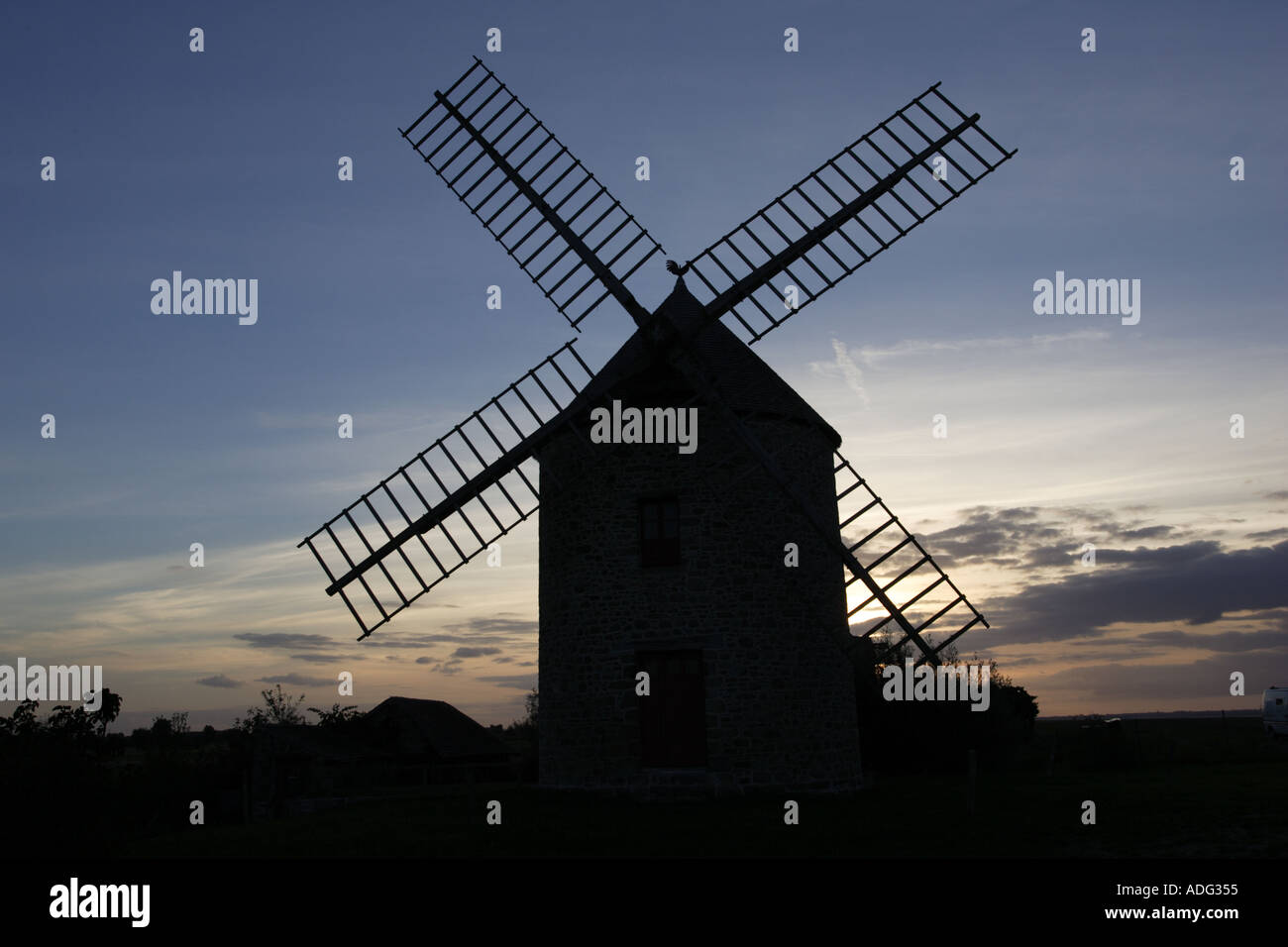 Windmill at sunset le Vivier sur Mer near Le Mont Michel Brittany ...