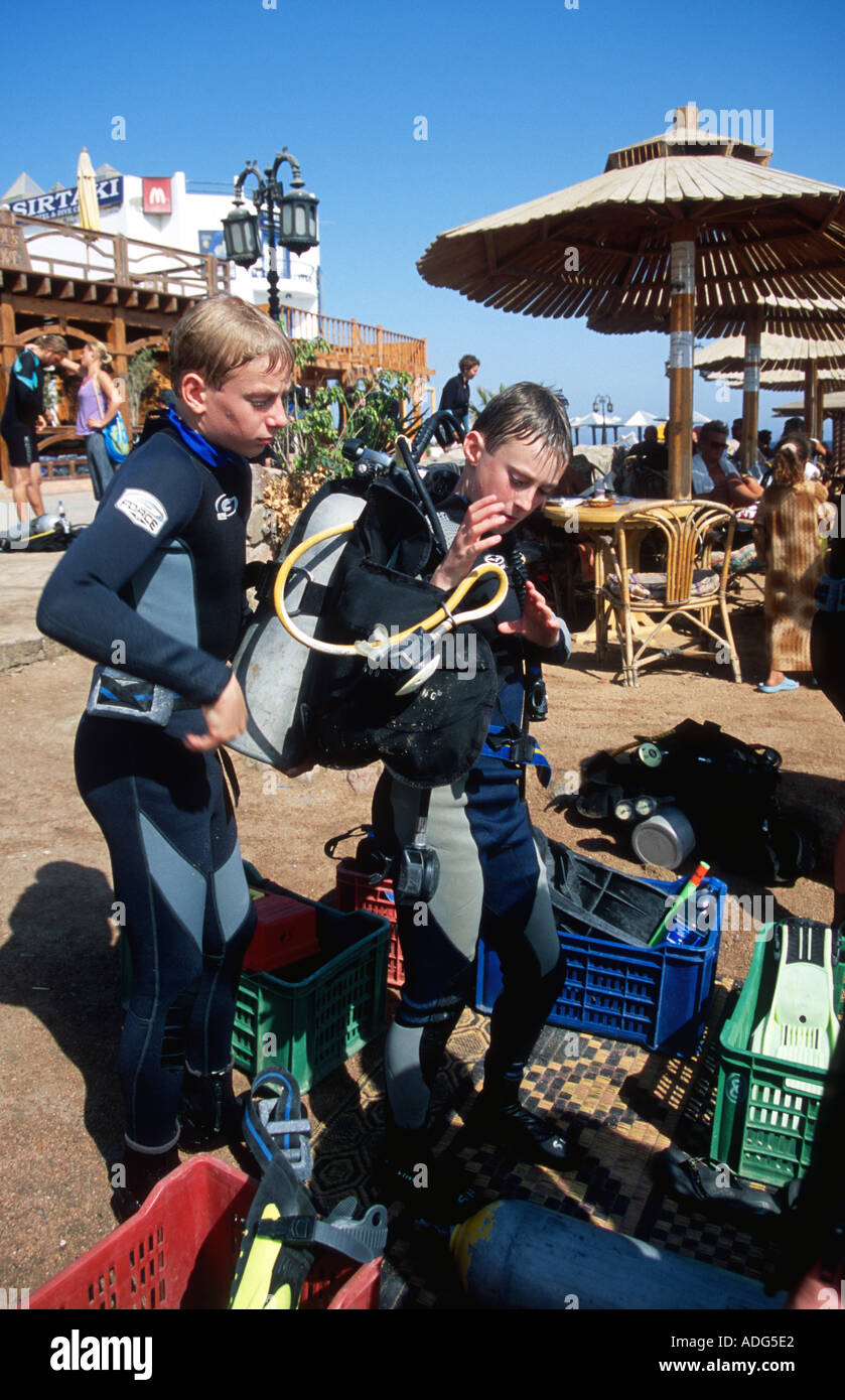 Boys getting ready for scuba dive Junior Open Water Lighthouse Reef ...