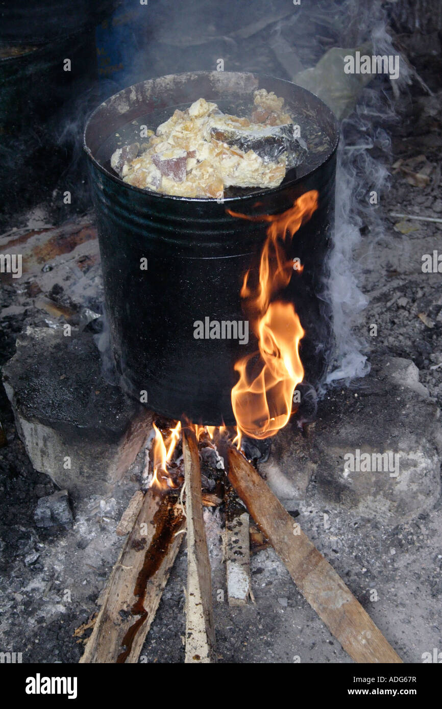 Wax being boiled in preparation for traditional method to print textile ...
