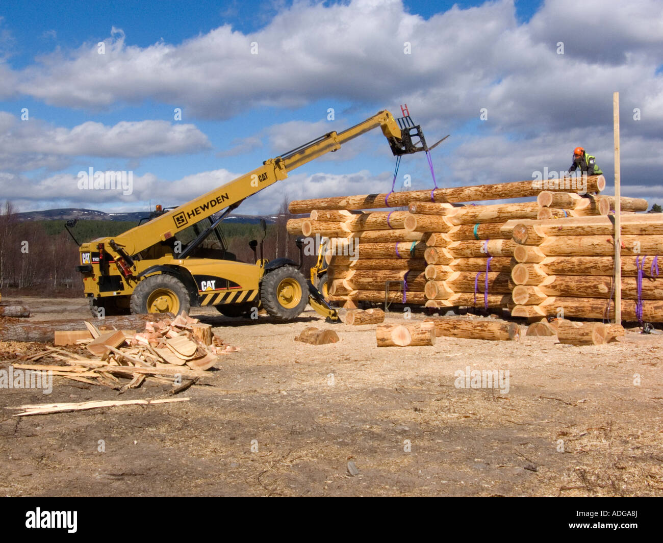 Log Cabin under Consrtuction with Telehandler Stock Photo - Alamy