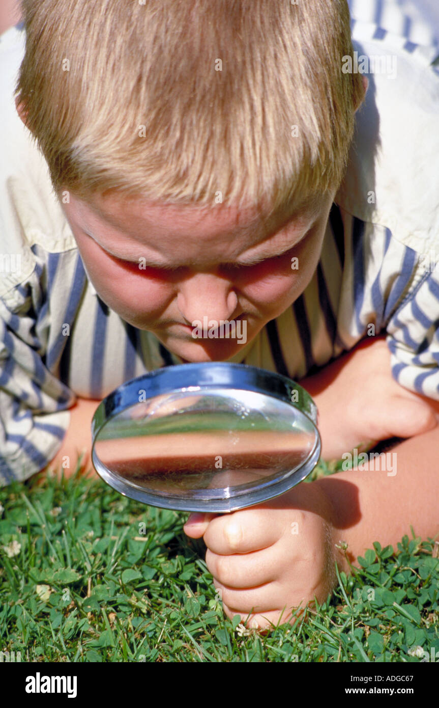 Boy with Magnifying Glass Stock Photo - Alamy