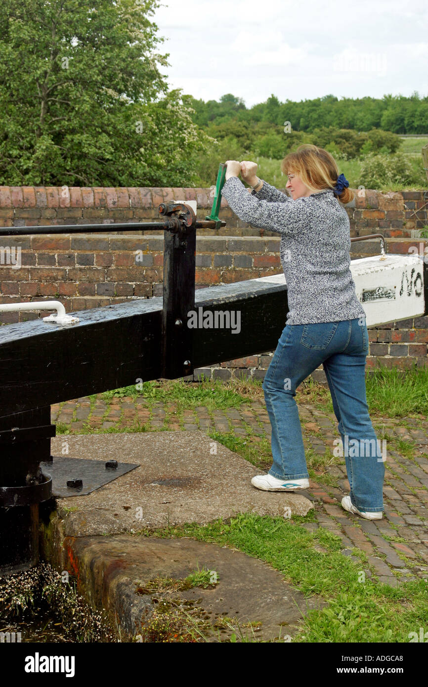 Operating lock gates on canal waterway in England Stock Photo - Alamy
