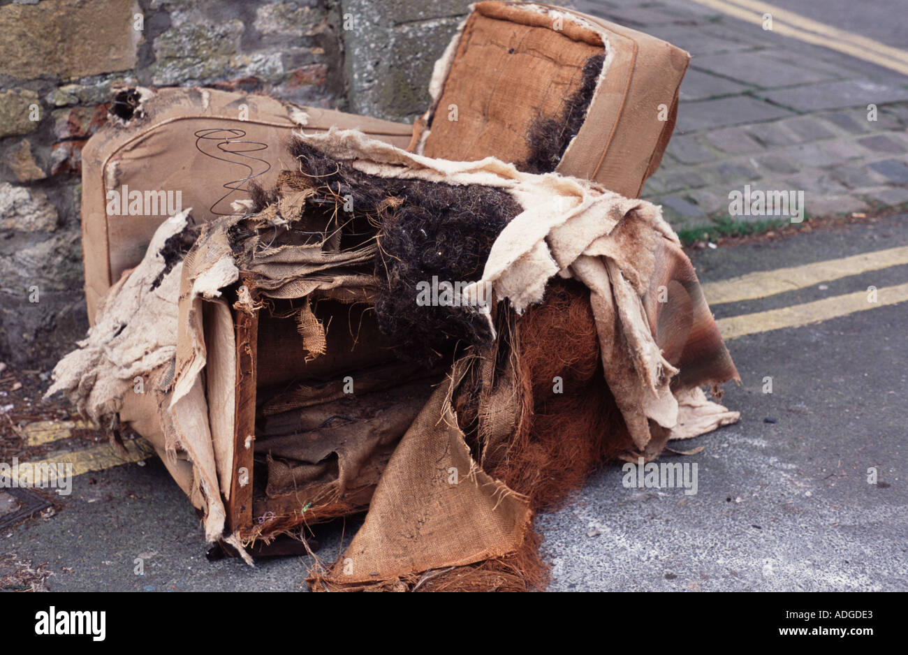 Broken battered armchair dumped street roadside chair torn armchair ...