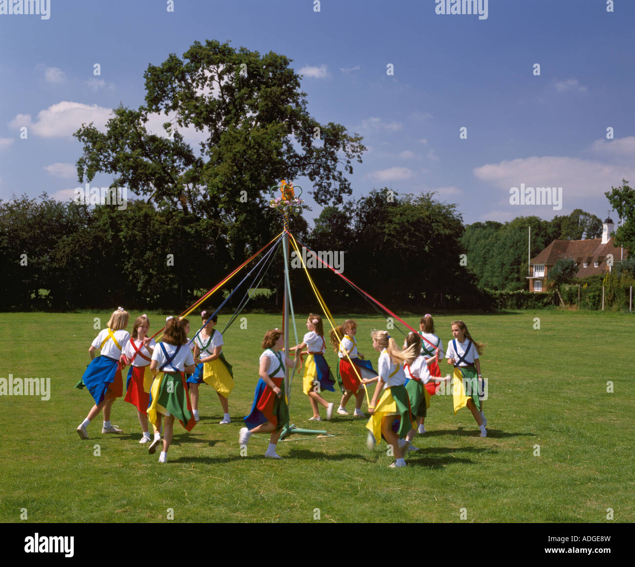 Young girls dancing round the maypole Stock Photo - Alamy