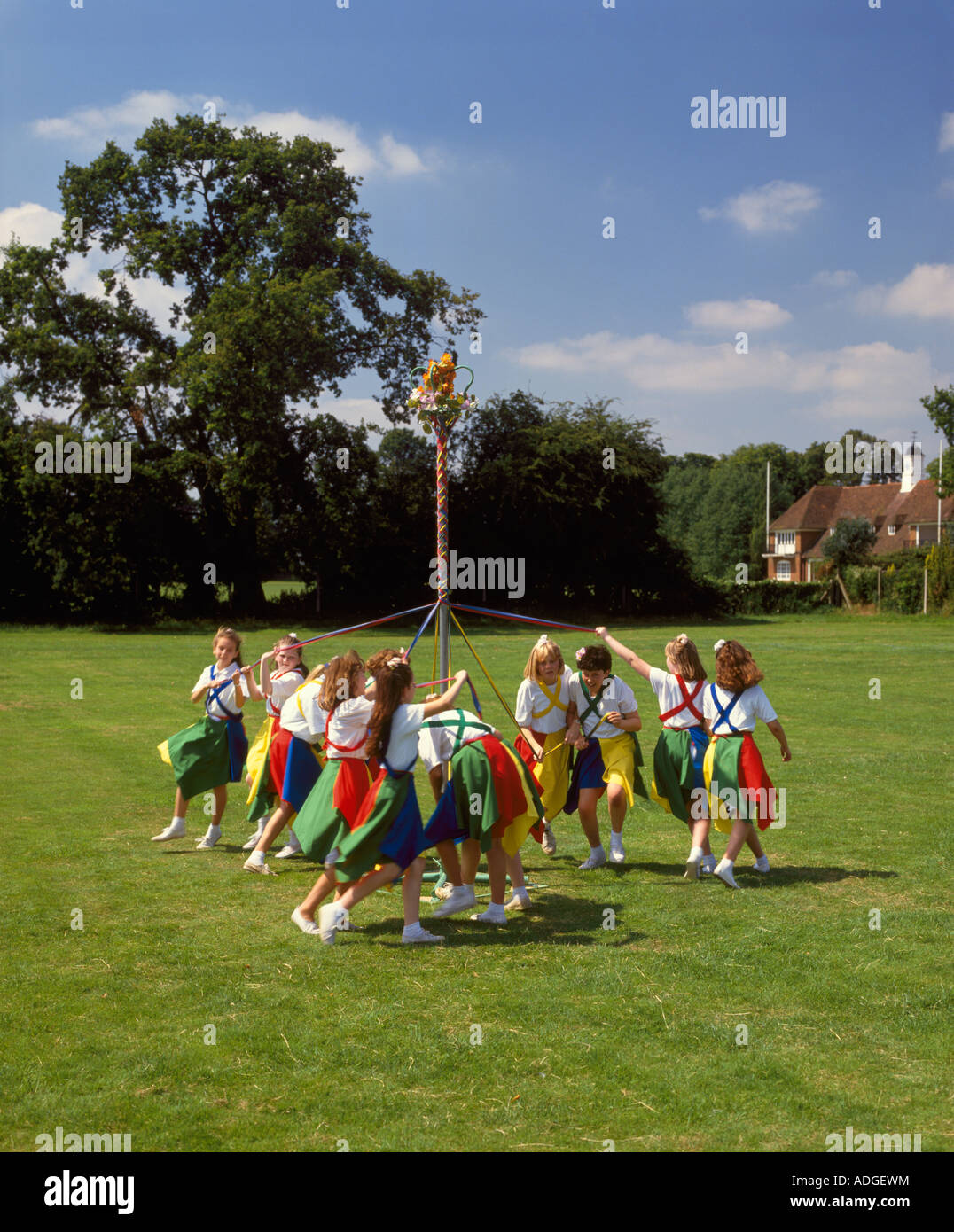 Young girls dancing round the maypole Stock Photo - Alamy