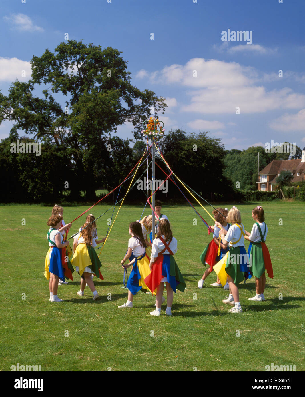 Young girls dancing round the maypole Stock Photo - Alamy