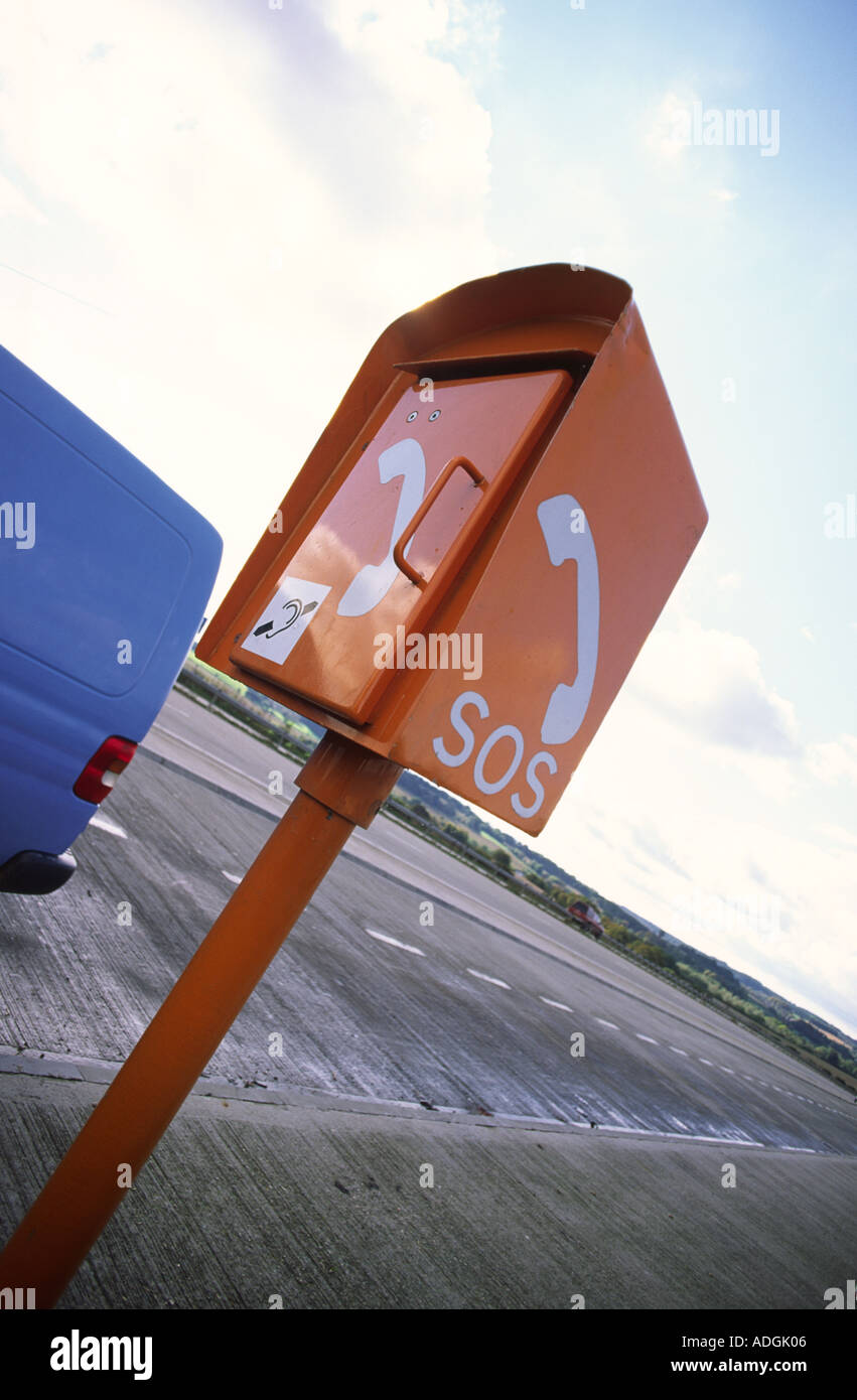SOS roadside assistance orange emergency telephone box Stock Photo - Alamy