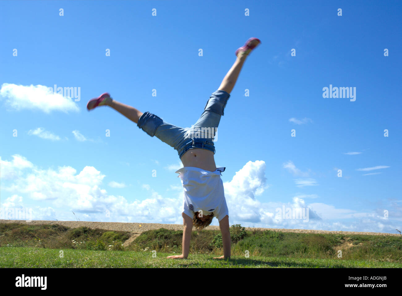 girl doing cartwheel Stock Photo - Alamy