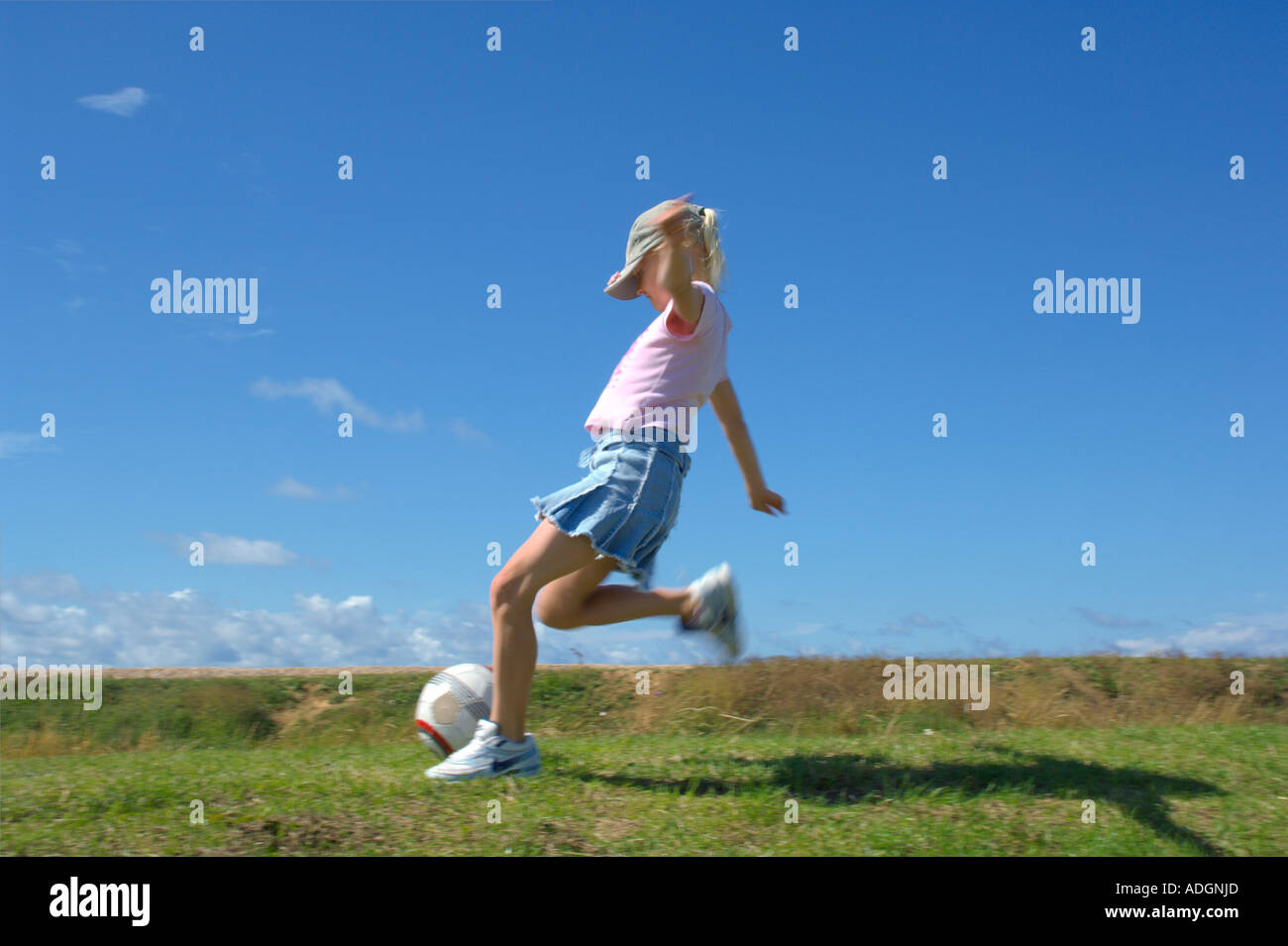 Girl with football hi-res stock photography and images - Alamy