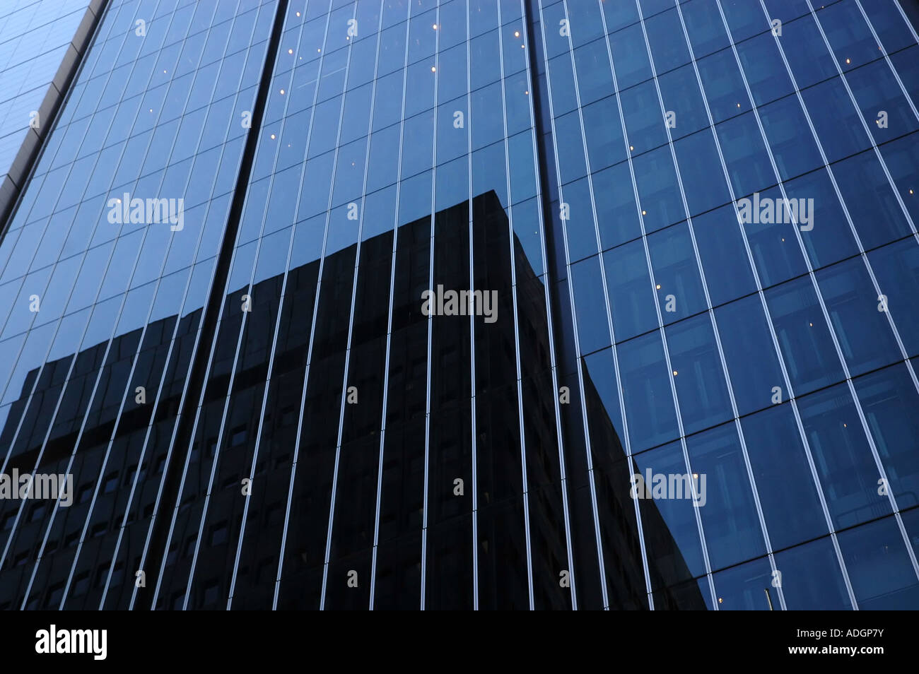 reflective glass wall of a modern office highrise Stock Photo - Alamy