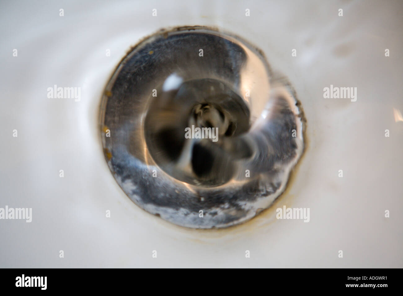 close up off water going down a plug hole Stock Photo - Alamy