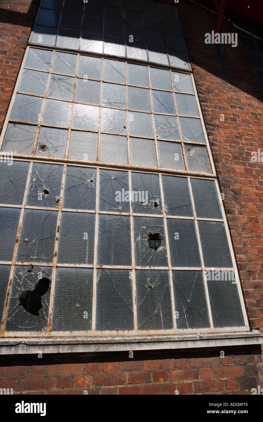 a big window which has some of the glass smashed Stock Photo - Alamy