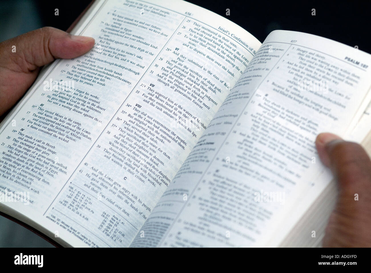 Close-up of a person holding an open Bible Stock Photo - Alamy