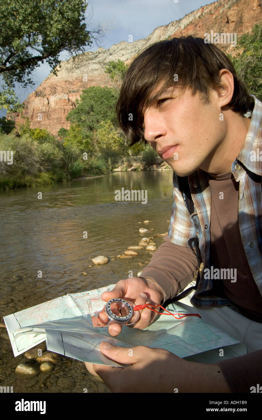 Hiker checking his map Stock Photo - Alamy