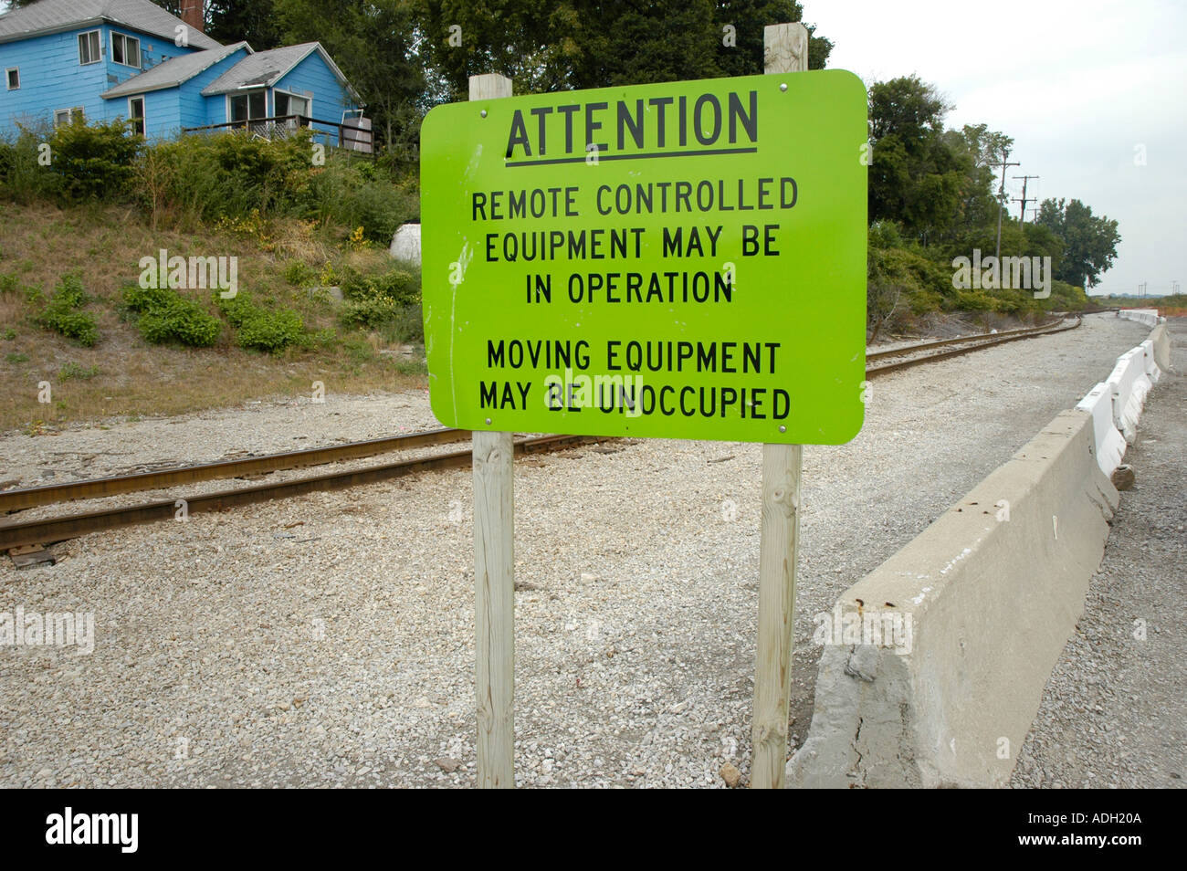Warning sign on Railroad train bed about remote controlled trains which ...